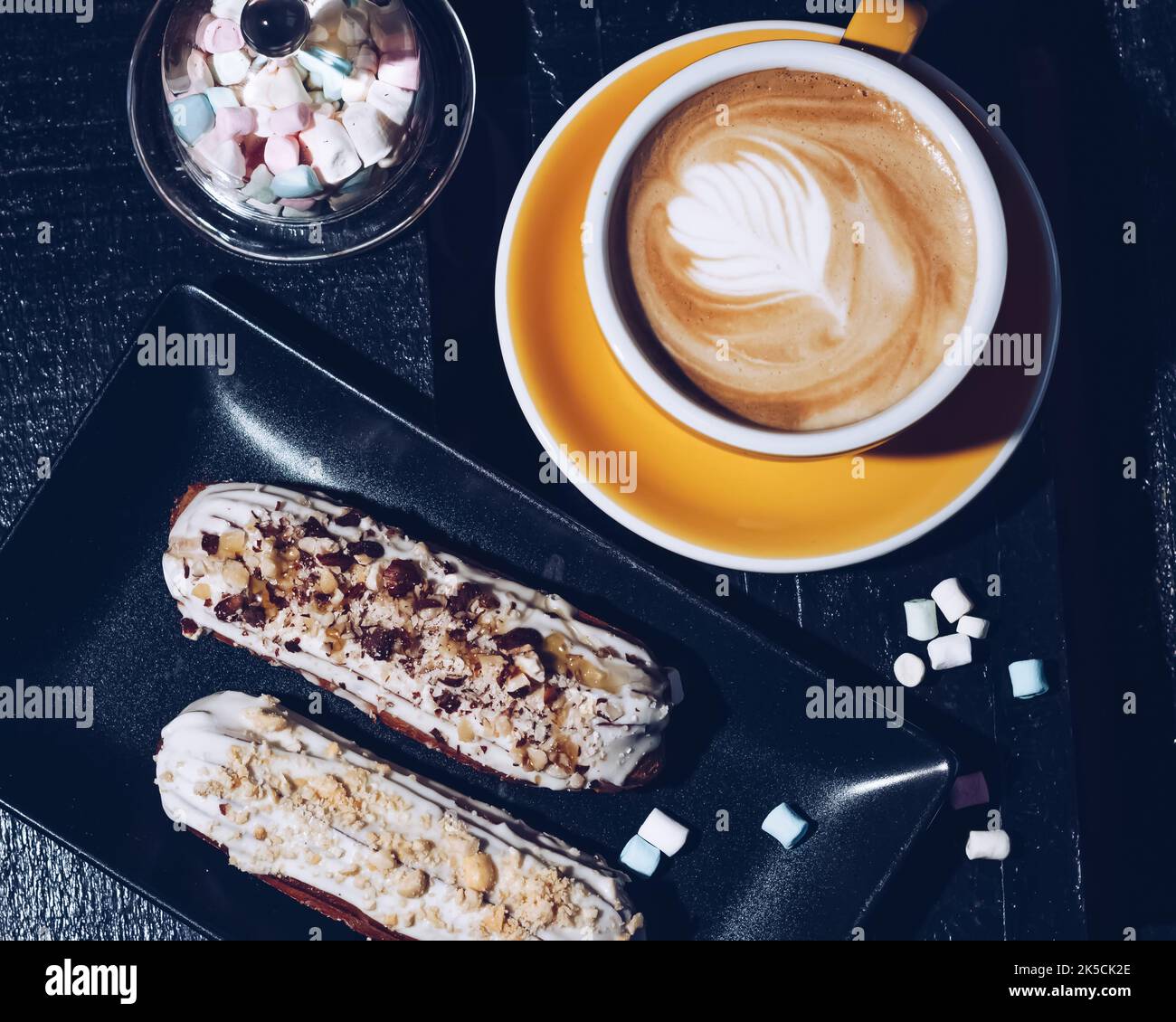 Top view of Traditional French dessert eclair with white chocolate ...