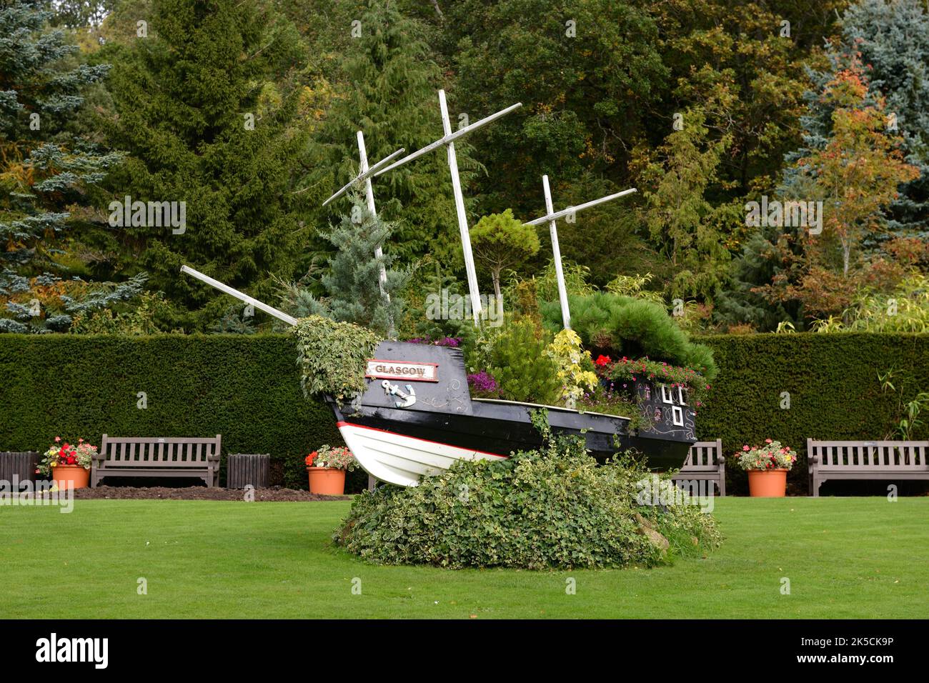 A small boat repurpoused as a garden feature at Pollok Country Park ...