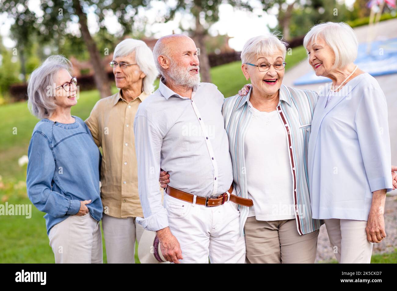Group of happy elderly people bonding outdoors at the park - Old people ...