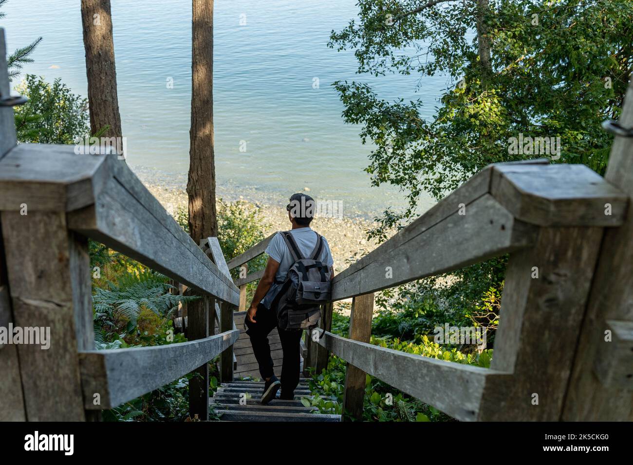 Man walking throguh the stairs Stock Photo - Alamy