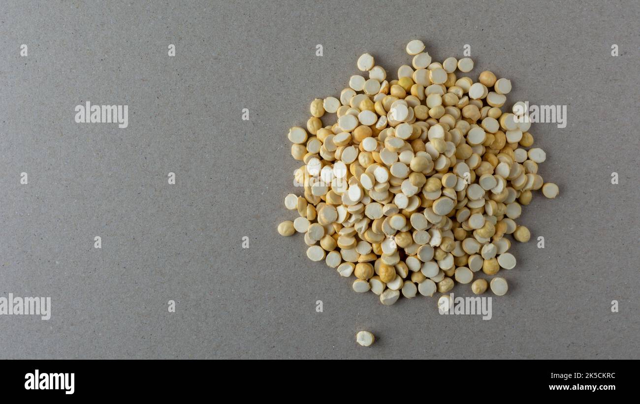 pile of roasted or fried bengal gram on a gray textured background ...