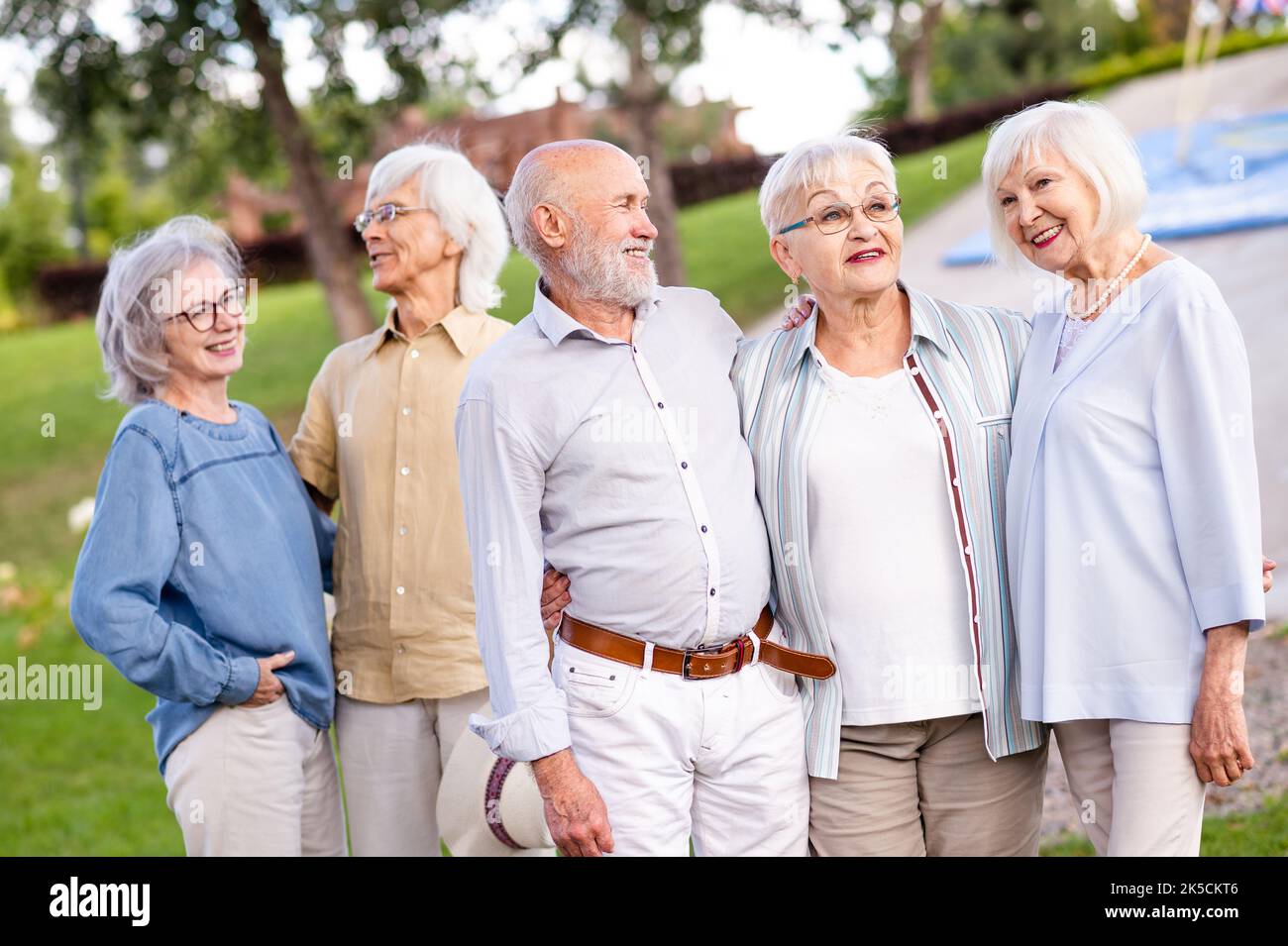 Group of happy elderly people bonding outdoors at the park - Old people ...