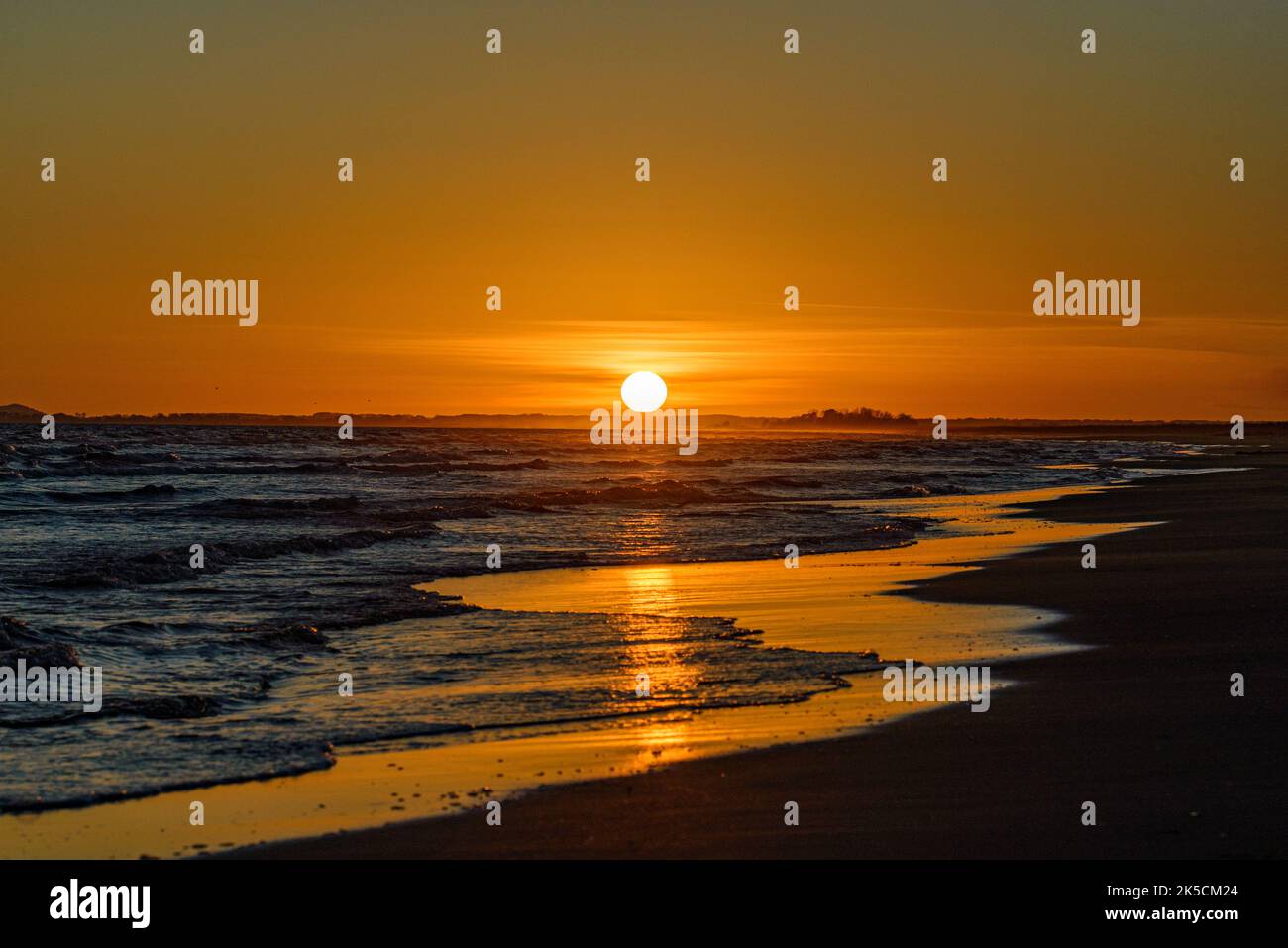 Seashore sunsets colors scenery Stock Photo - Alamy