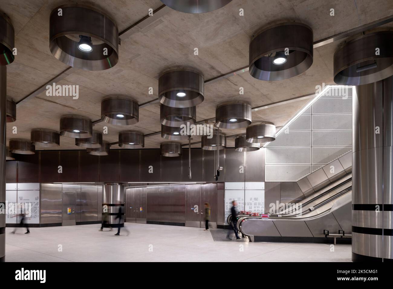 Wide view of circulation and escalator showing lighting drums ...
