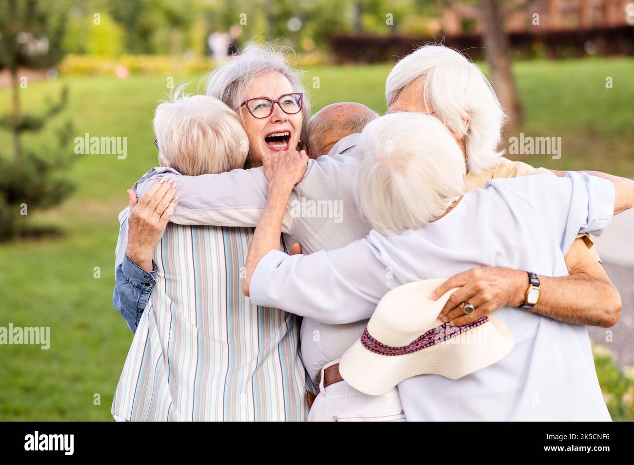 Group of happy elderly people bonding outdoors at the park - Old people ...