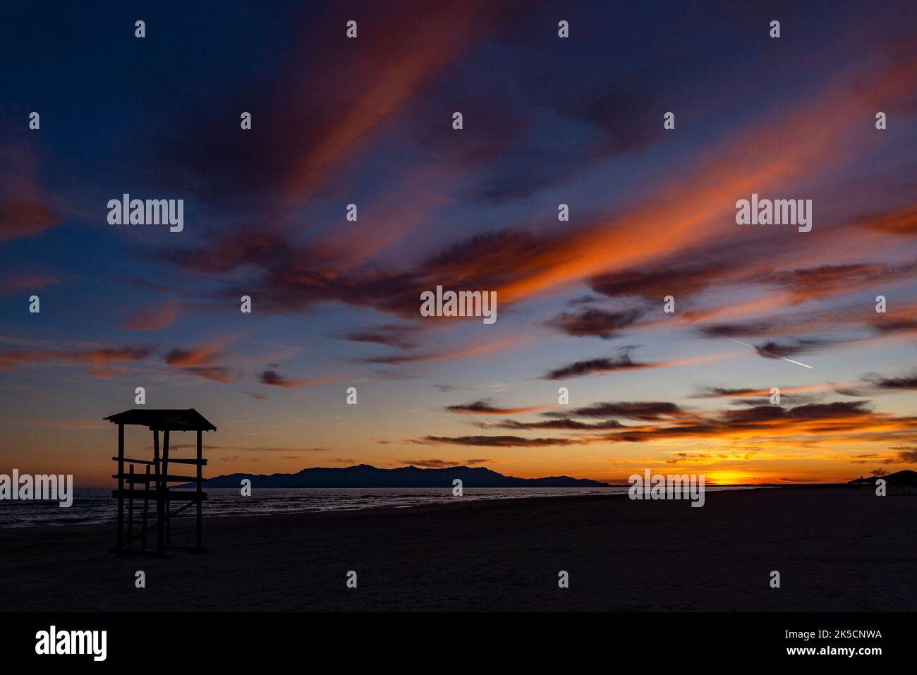 Seashore sunsets colors scenery Stock Photo - Alamy