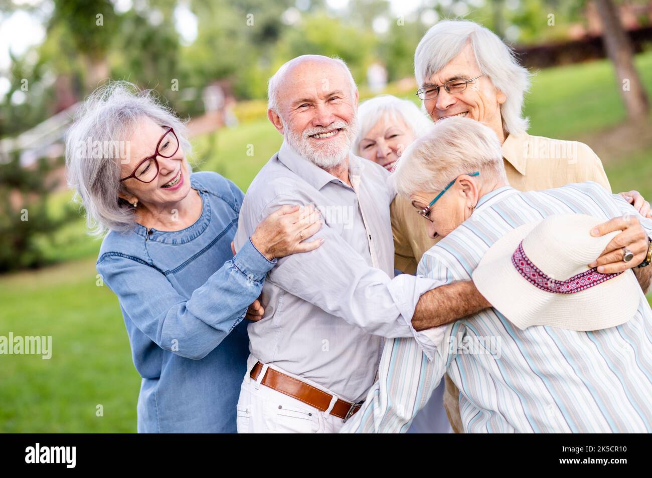 Group of happy elderly people bonding outdoors at the park - Old people ...