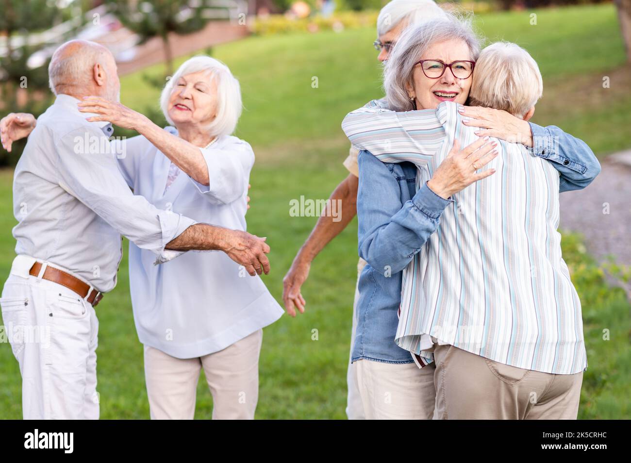 Group of happy elderly people bonding outdoors at the park - Old people ...