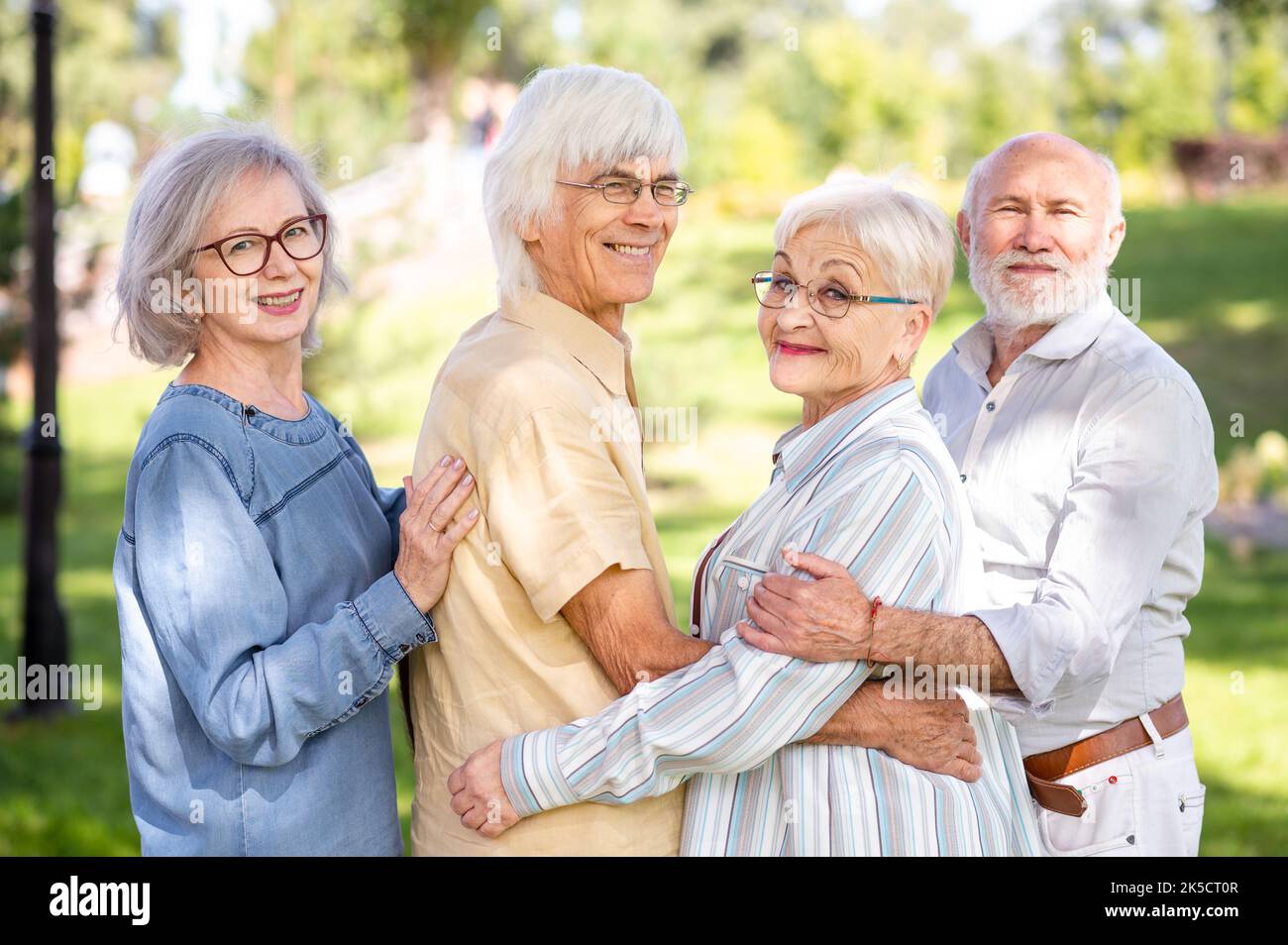 Group of happy elderly people bonding outdoors at the park - Old people ...
