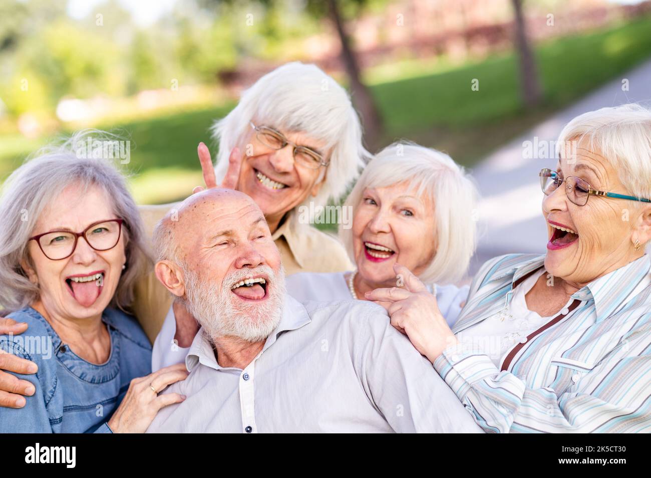 Group of happy elderly people bonding outdoors at the park - Old people ...