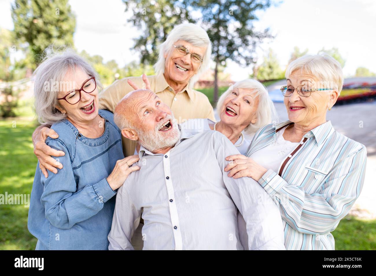 Group of happy elderly people bonding outdoors at the park - Old people ...