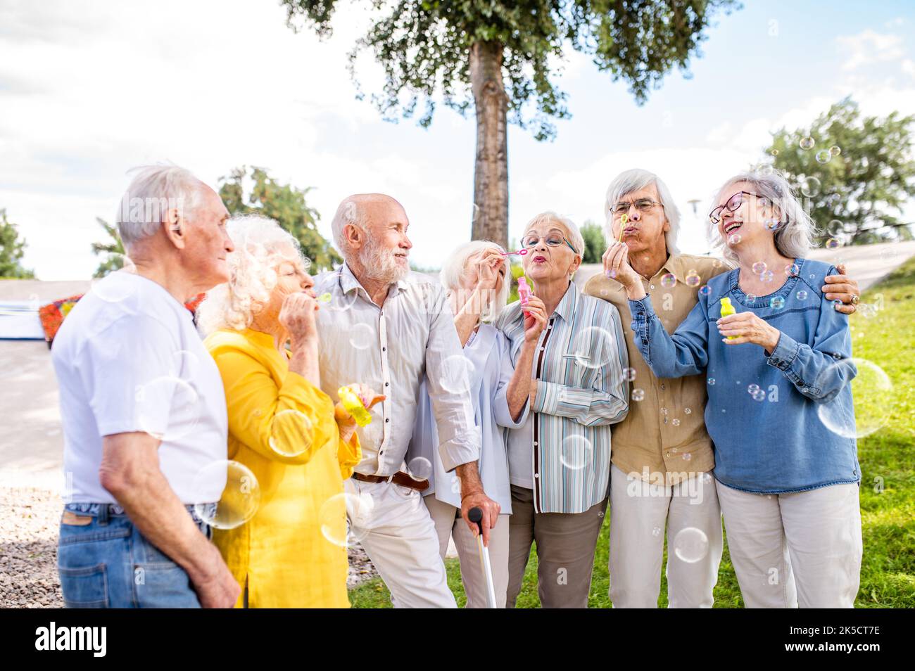 Group of happy elderly people bonding outdoors at the park - Old people ...
