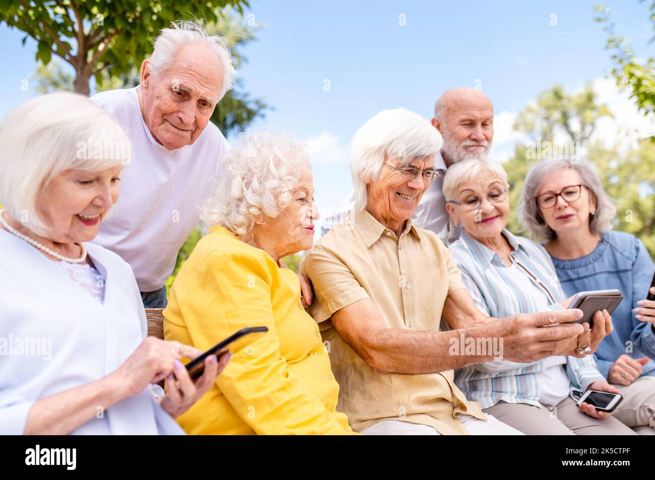 Group of happy elderly people bonding outdoors at the park - Old people ...