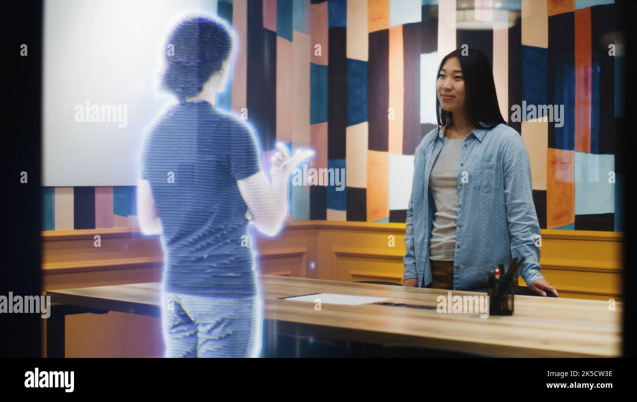 Asian woman talks on the call with her friend using augmented reality ...