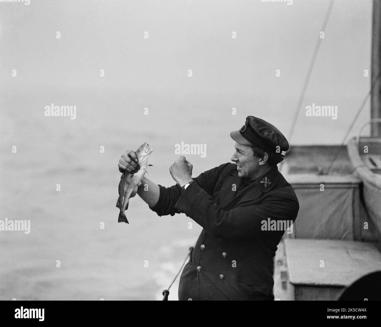 The Royal Navy on the Home Front, 1914-1918 Sailor posing with a fish ...