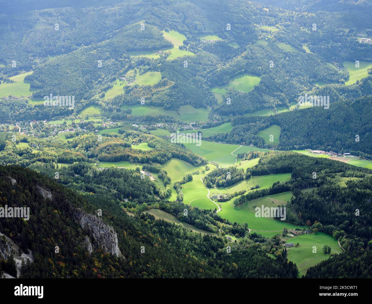 View of the surrounding villages and hills from the Rax mountain range ...