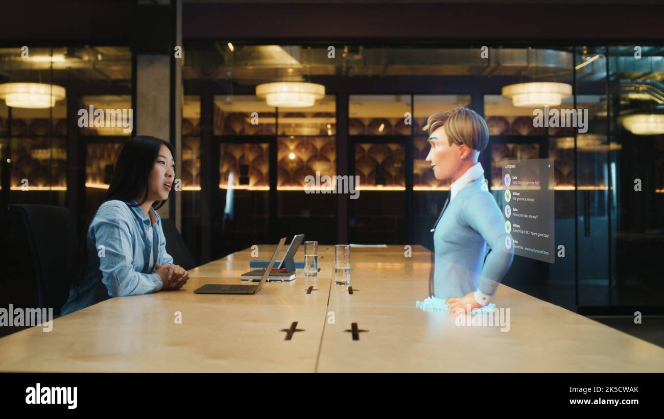Video call chat conference of an asian woman using hologram technology. Conversing with a ...
