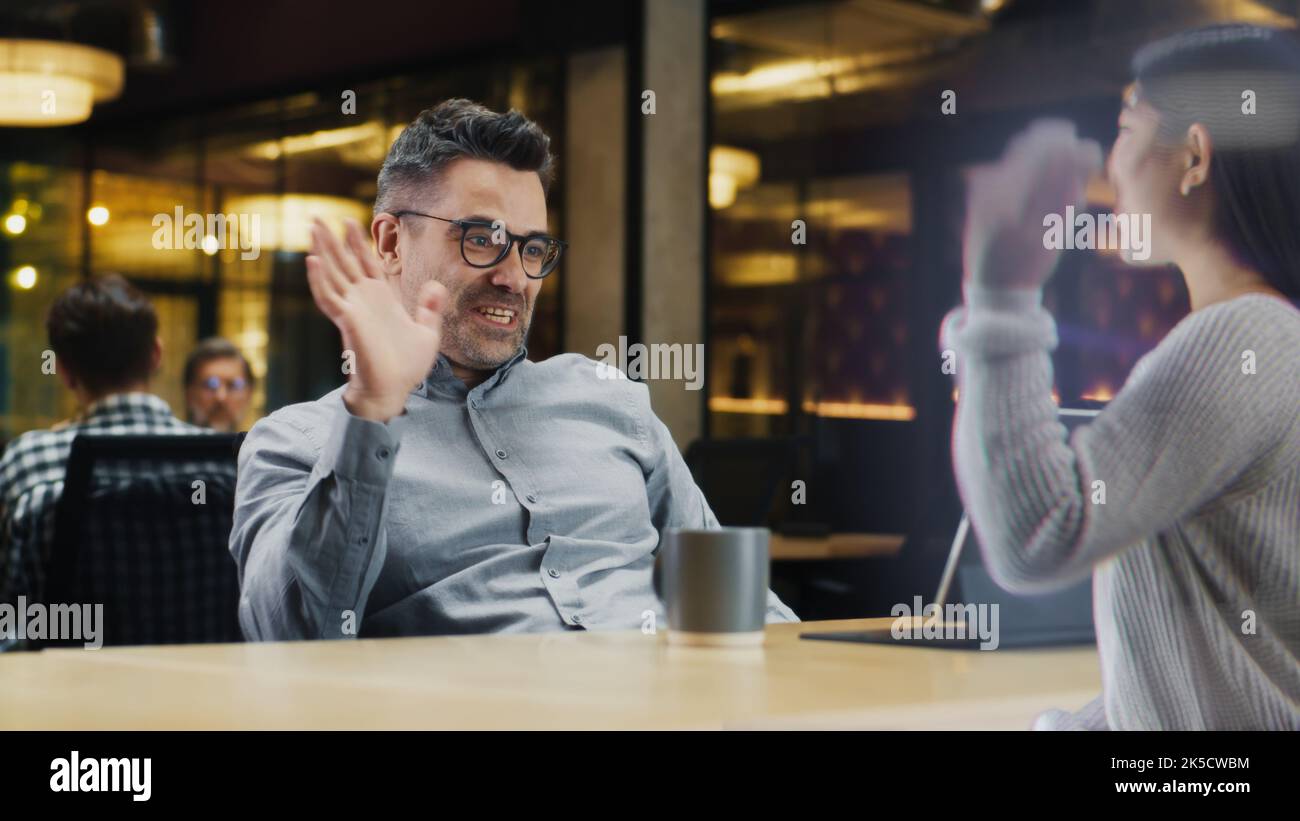 Woman talks on the call with her friend using holographic software ...