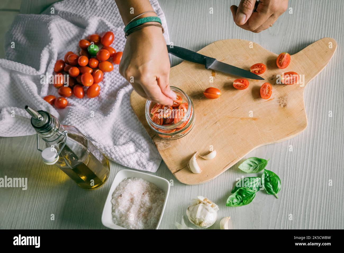 homemade preparation, tomatoes in oil with garlic, basil Stock Photo ...