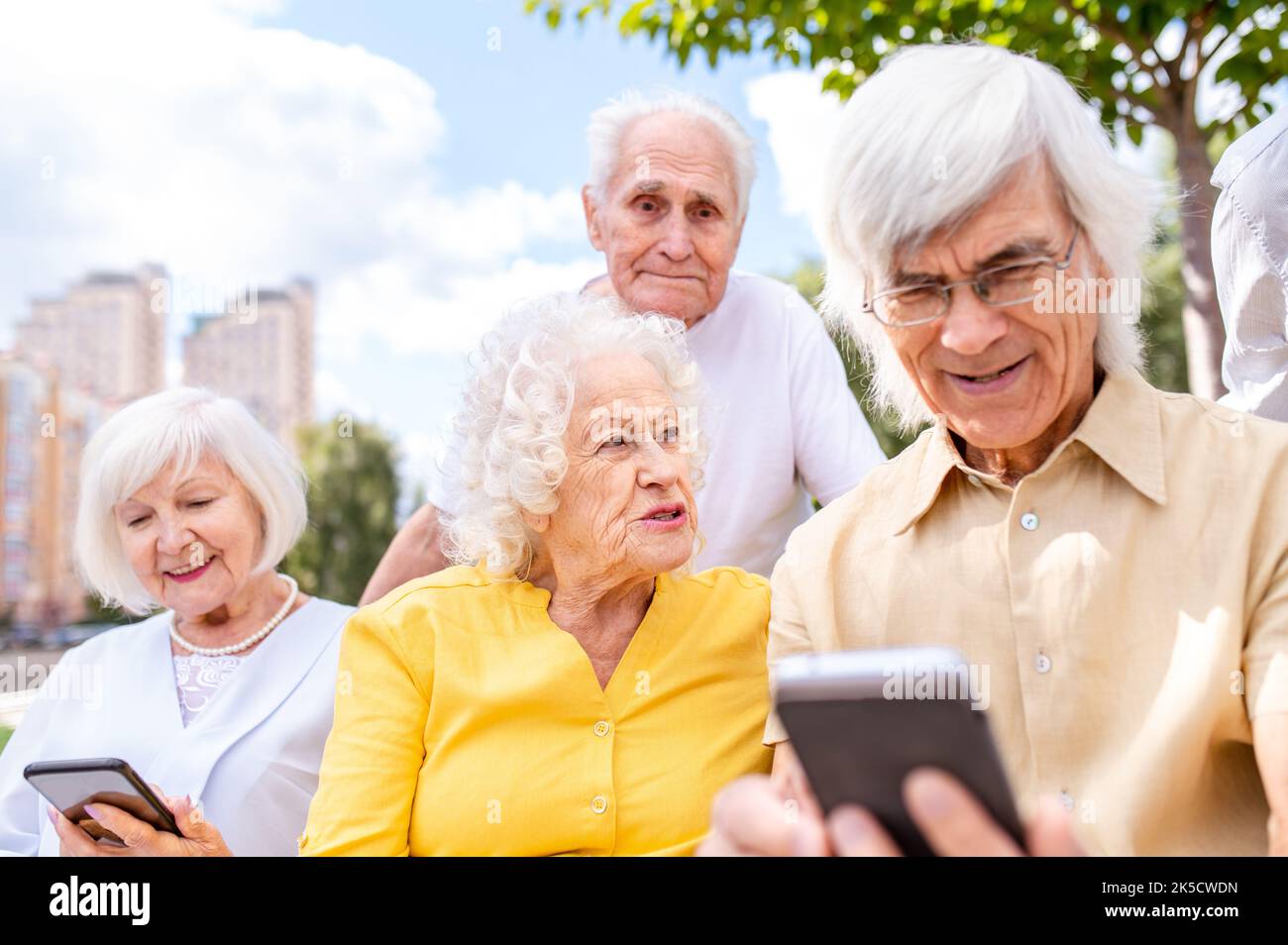 Group of happy elderly people bonding outdoors at the park - Old people ...