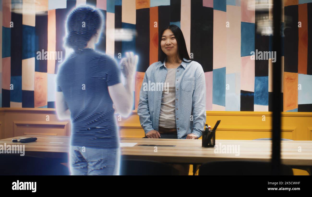 Asian woman talks on the call with her friend using augmented reality ...