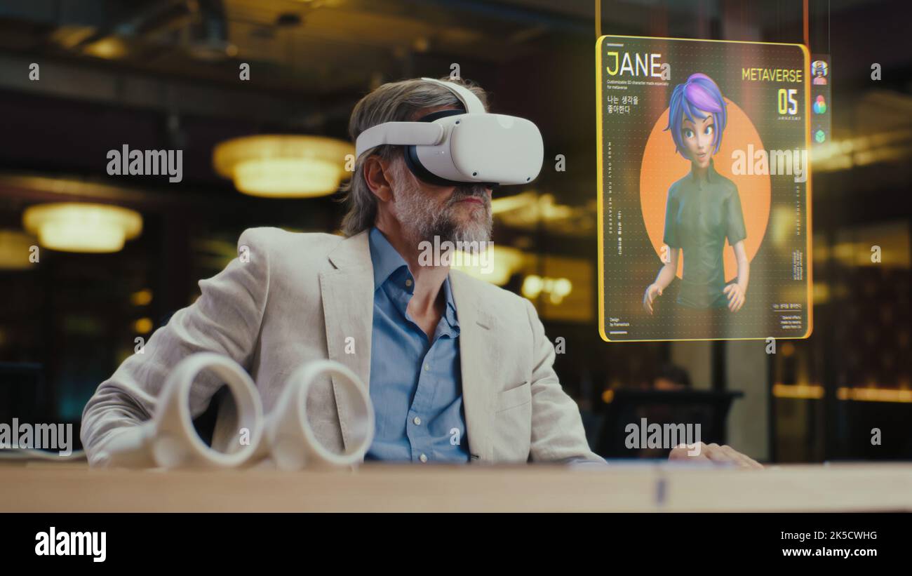 Middle aged man with VR headset communicates with virtual character ...