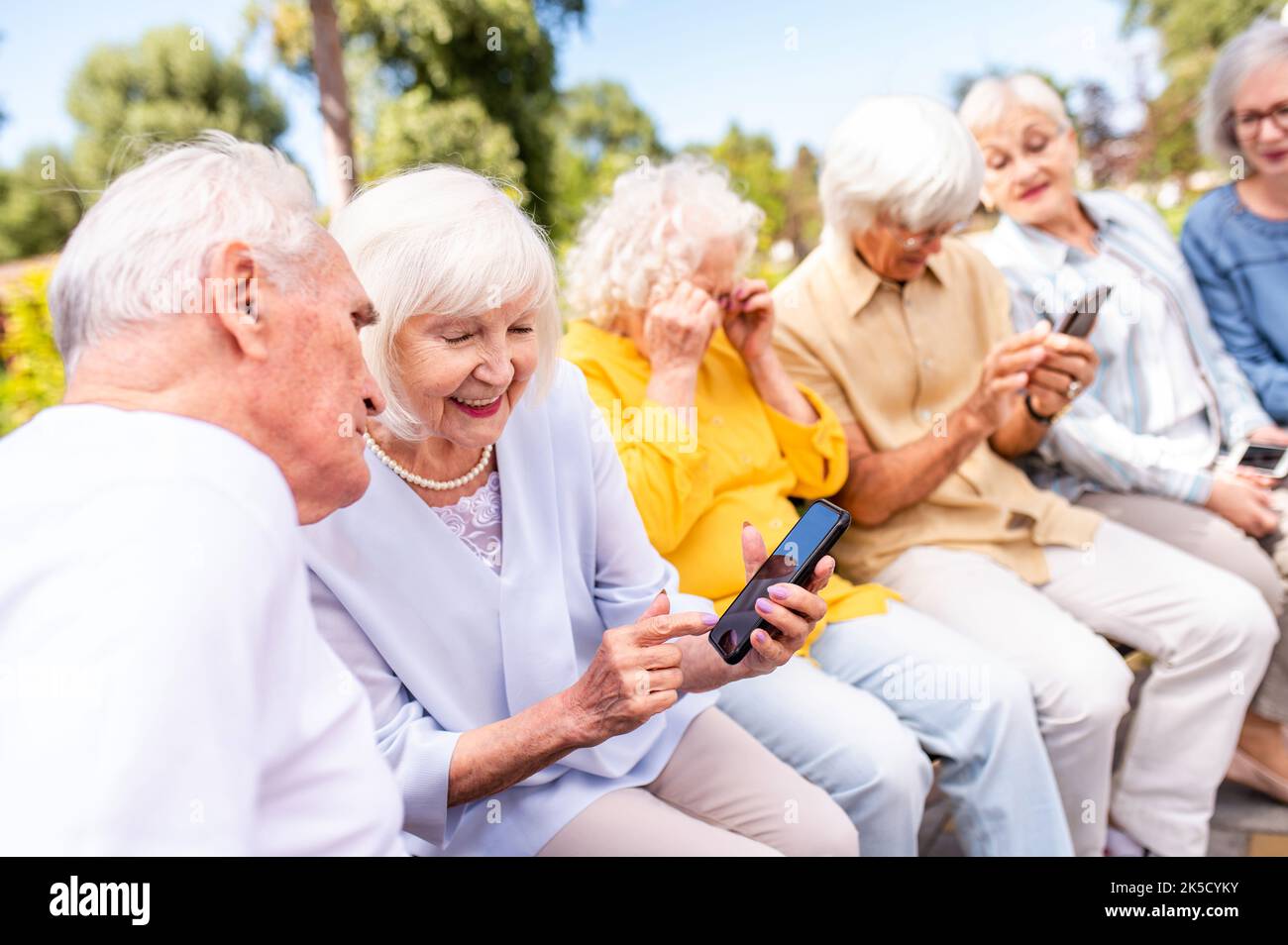 Group of happy elderly people bonding outdoors at the park - Old people ...