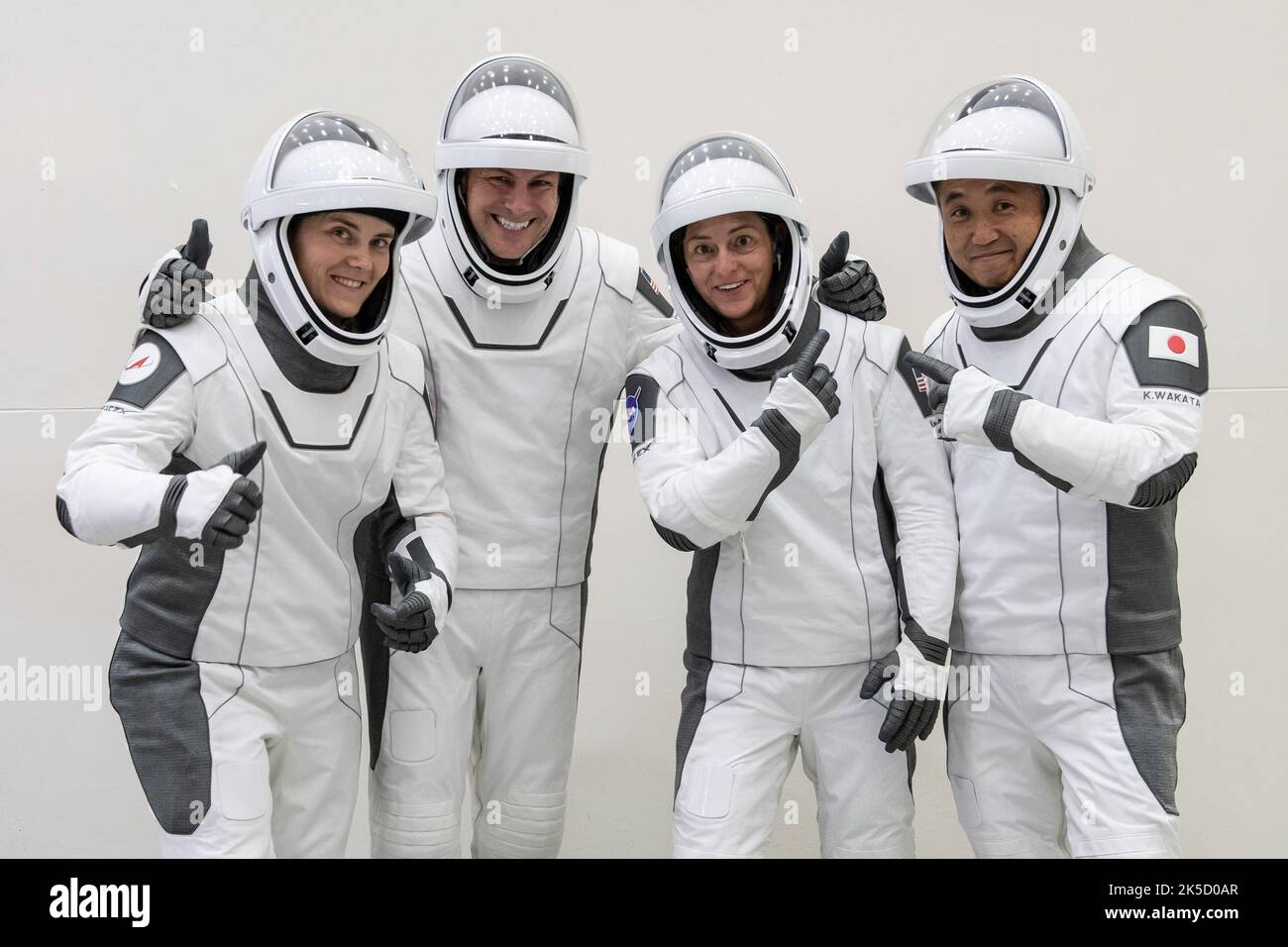SpaceX Crew-5 astronauts give a thumbs up during a crew equipment ...