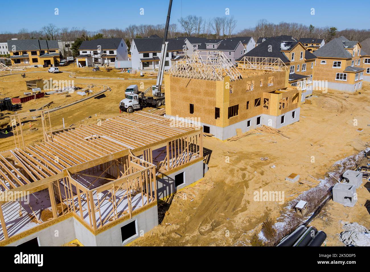 Aerial view of construction site on new modern cottages in the suburbs ...