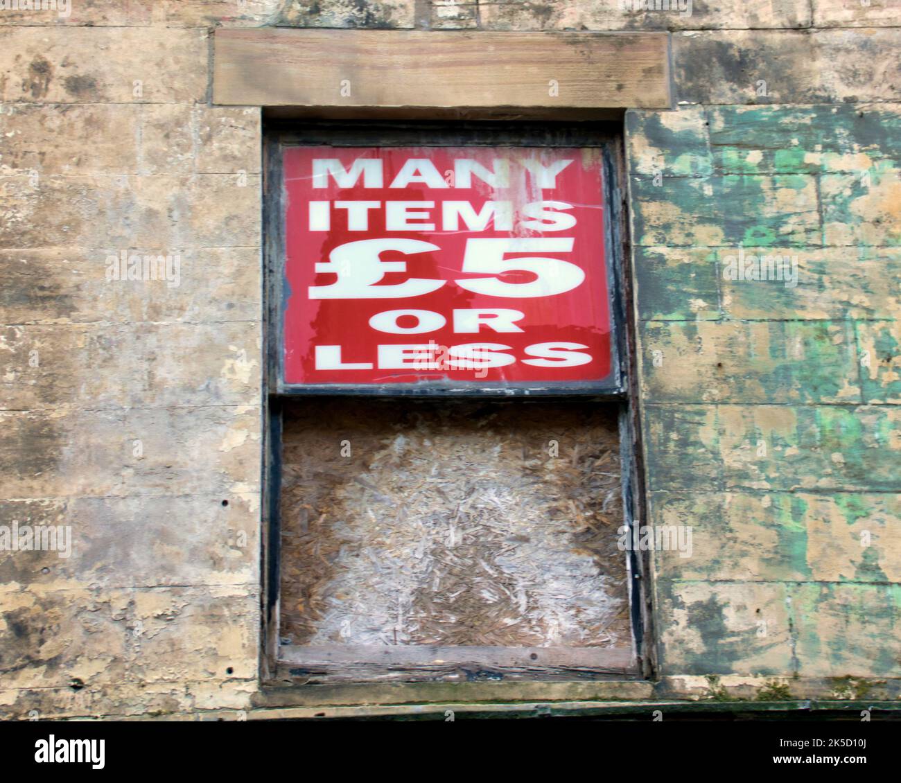 Run down dilapidated building advertising windows representing poverty ...