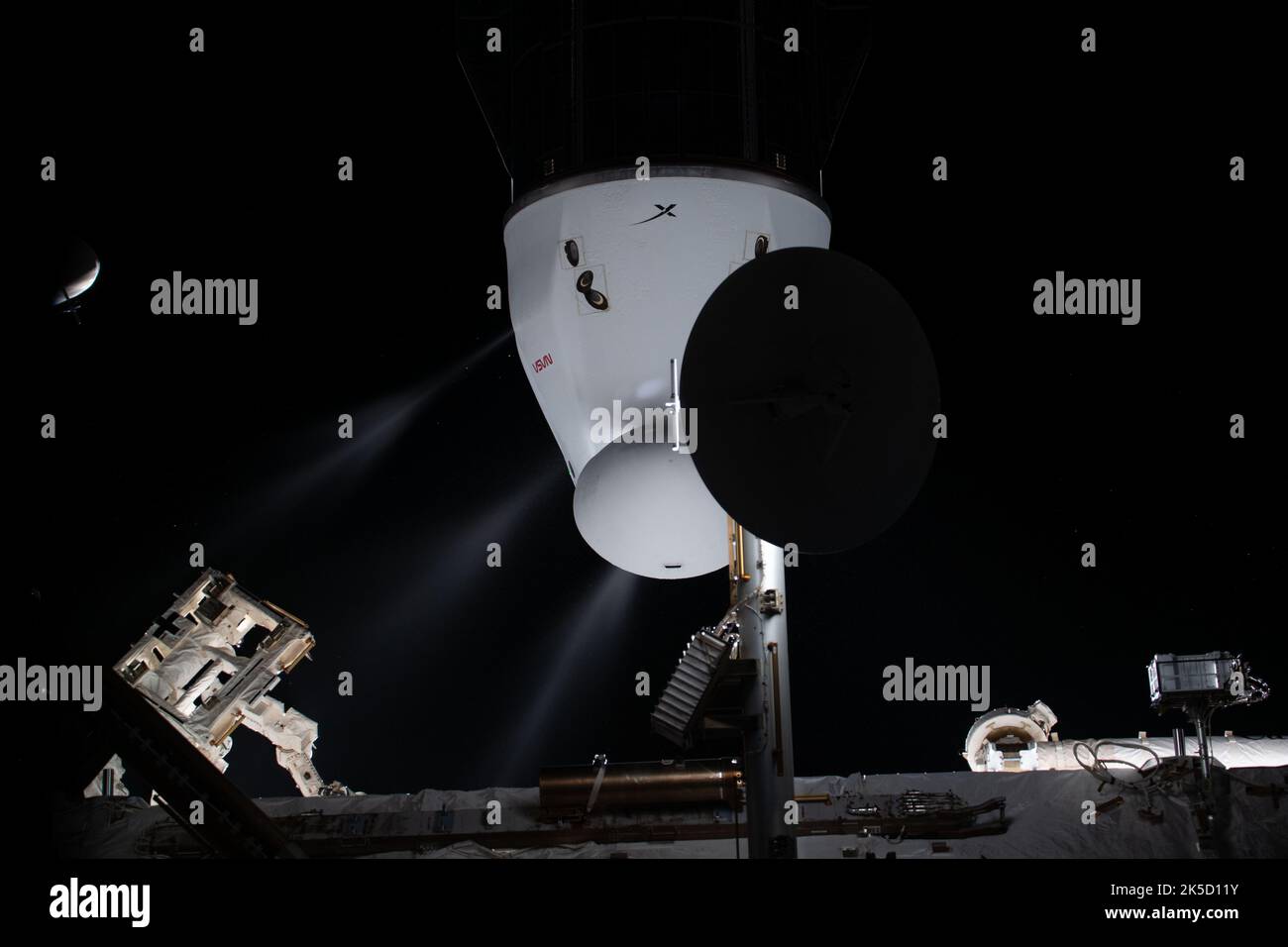 Plumes are pictured from the SpaceX Cargo Dragon resupply ship's Draco ...