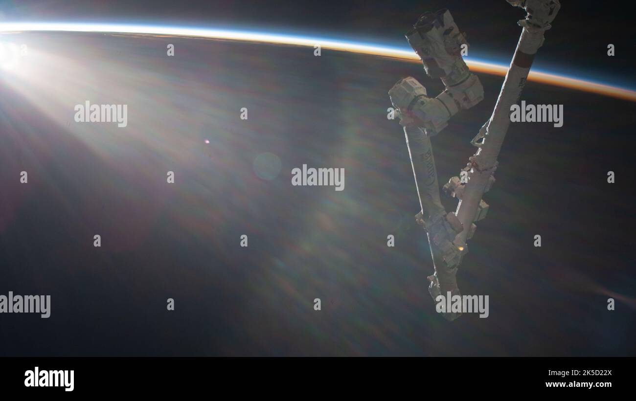 An orbital sunrise begins illuminating Earth's atmosphere with the ...