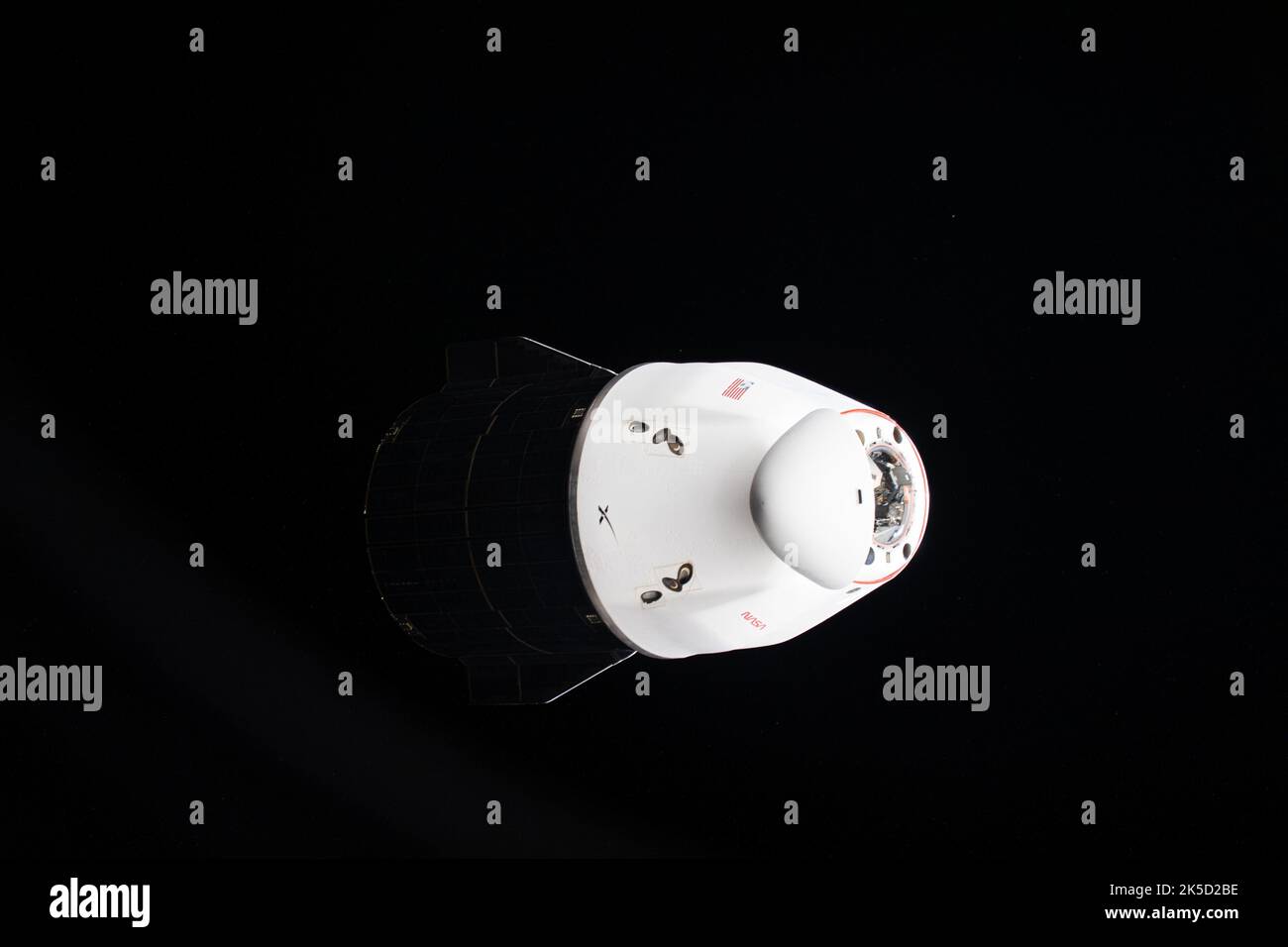 The bright, white pressurized capsule of the SpaceX Cargo Dragon ...