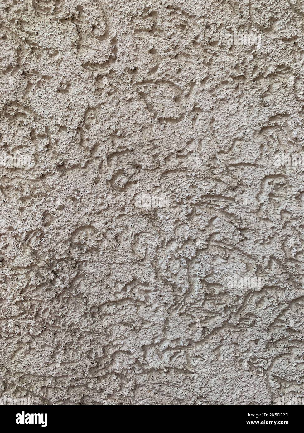 A vertical shot of a stucco texture wall Stock Photo - Alamy