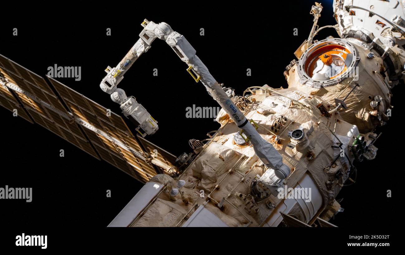 The European robotic arm (ERA) is pictured extending out from the Nauka ...