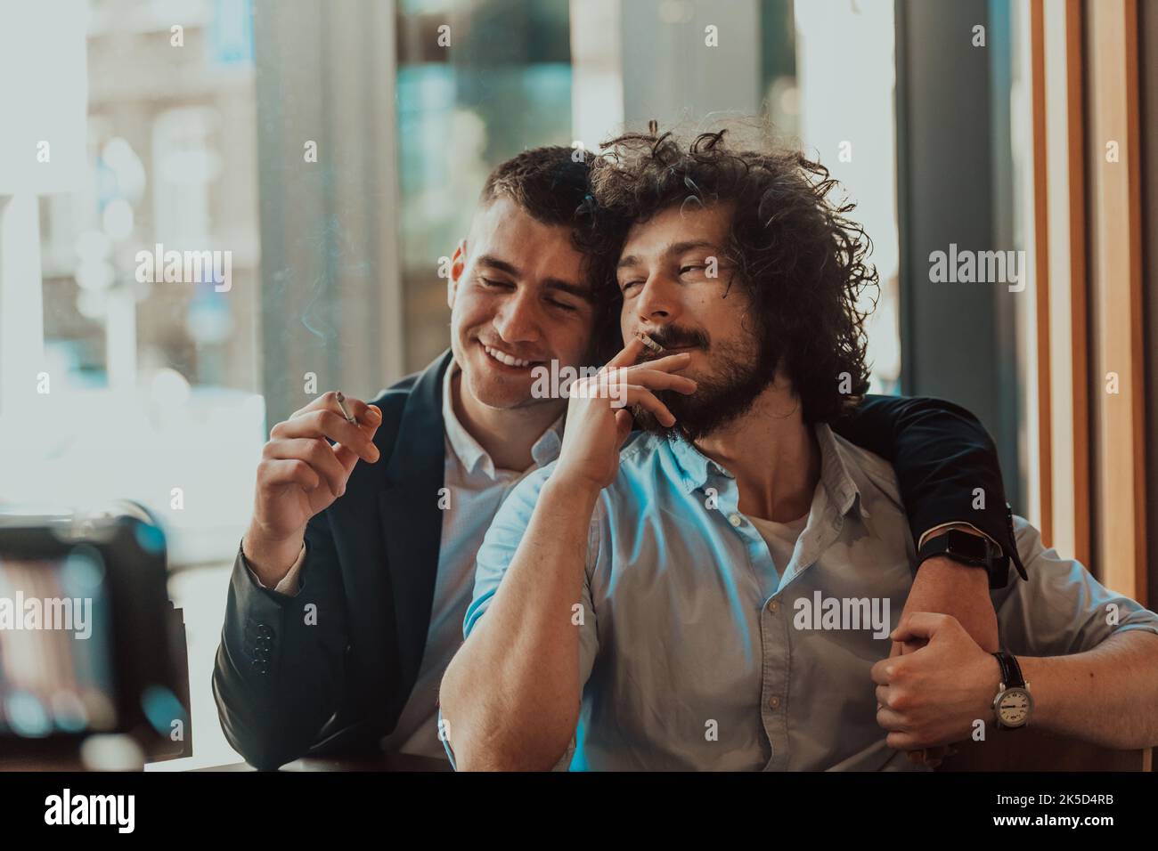 Portrait of multiethnic diverse gay LGBT romantic male couple embracing ...