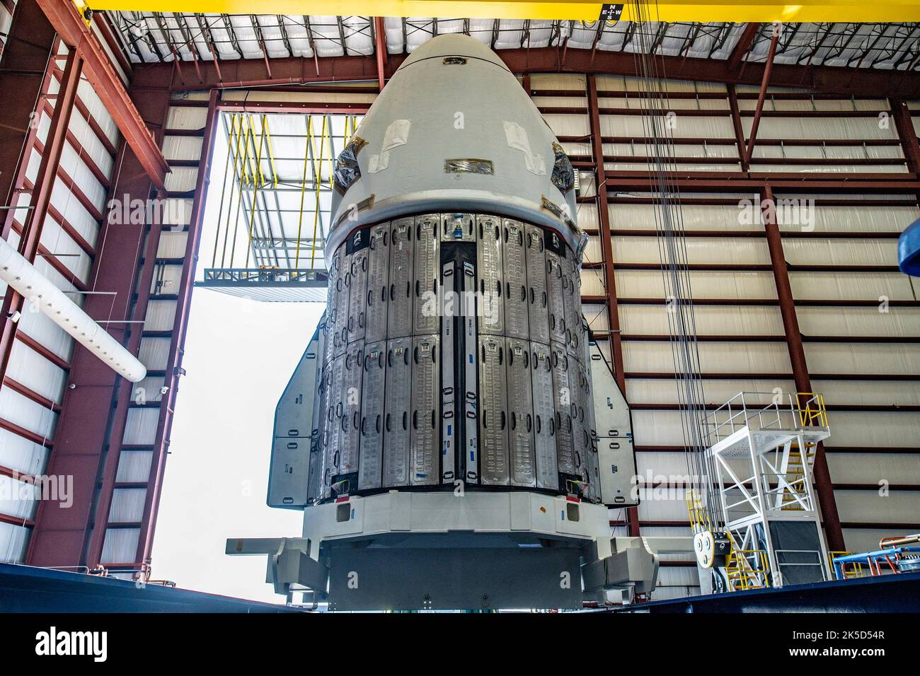 The Crew Dragon Endurance spacecraft for NASA’s SpaceX Crew-5 mission arrives at the hangar at ...