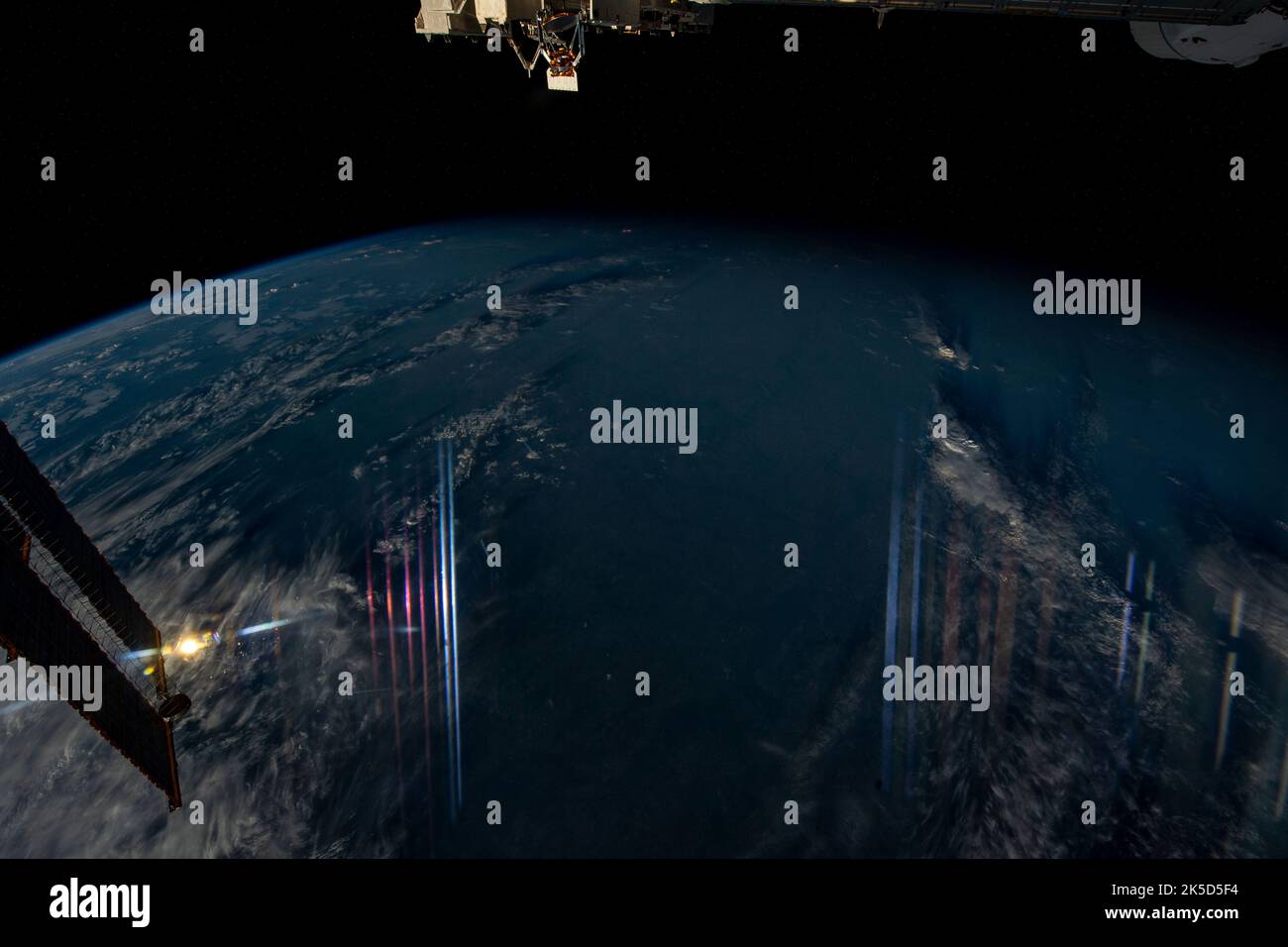Instrumentation lights reflect off a window on the International Space Station as it orbited 260 ...