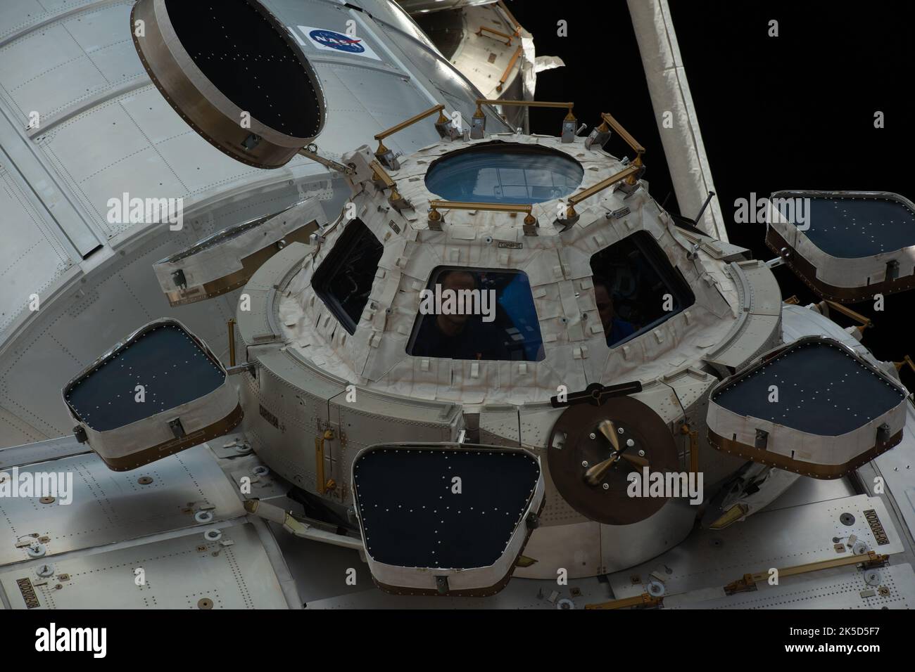NASA astronaut and Expedition 66 Flight Engineer Thomas Marshburn peers ... NASA astronaut and Expedition 66 Flight Engineer Thomas Marshburn peers ...