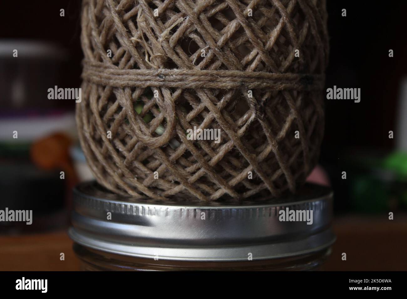 A closeup of a jute twine ball on top of jar lid Stock Photo - Alamy