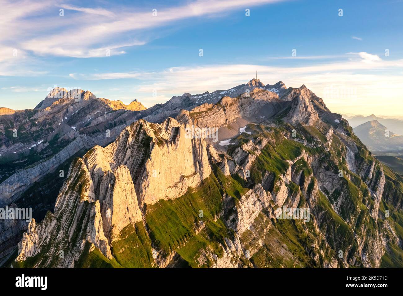 View of a sunset in front of the crest of Santis and the below valley ...