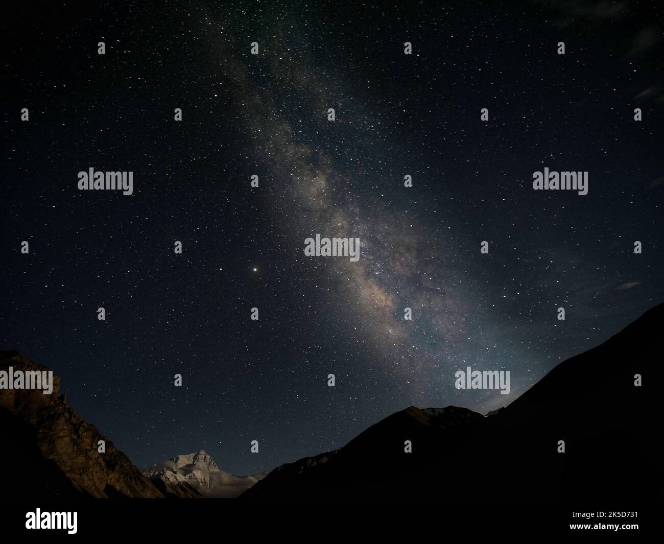 The fascinating milky way over mountains in a starry night Stock Photo ...