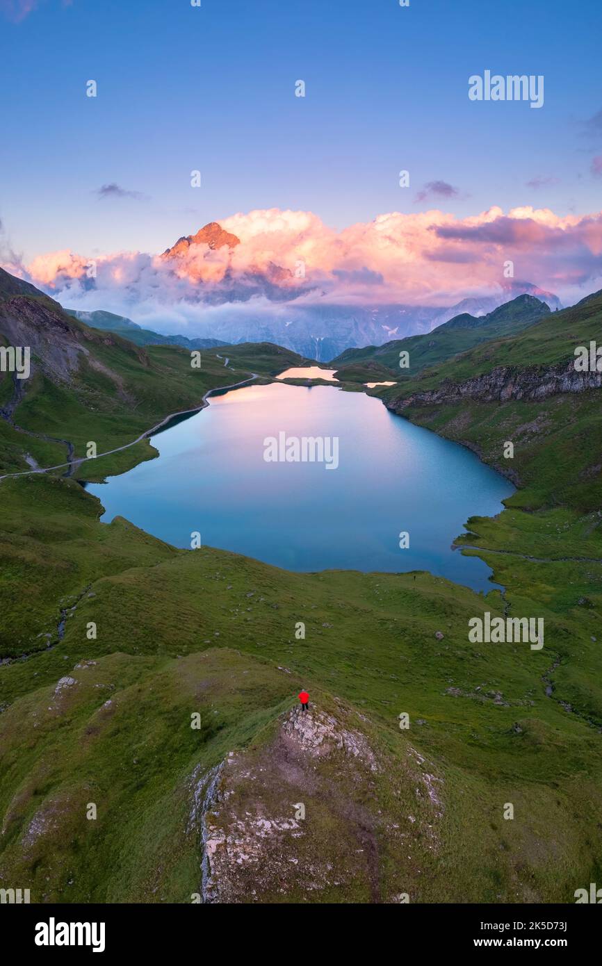 Aerial view of a person admiring the Bachalpsee lake during a summer ...