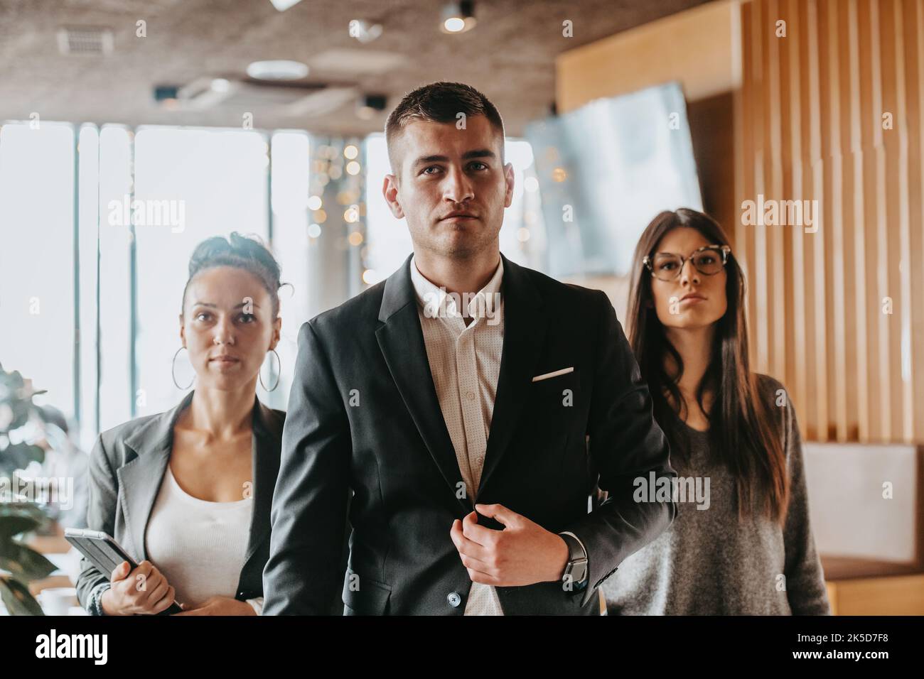 Group of successful business people standing together at office Stock ...