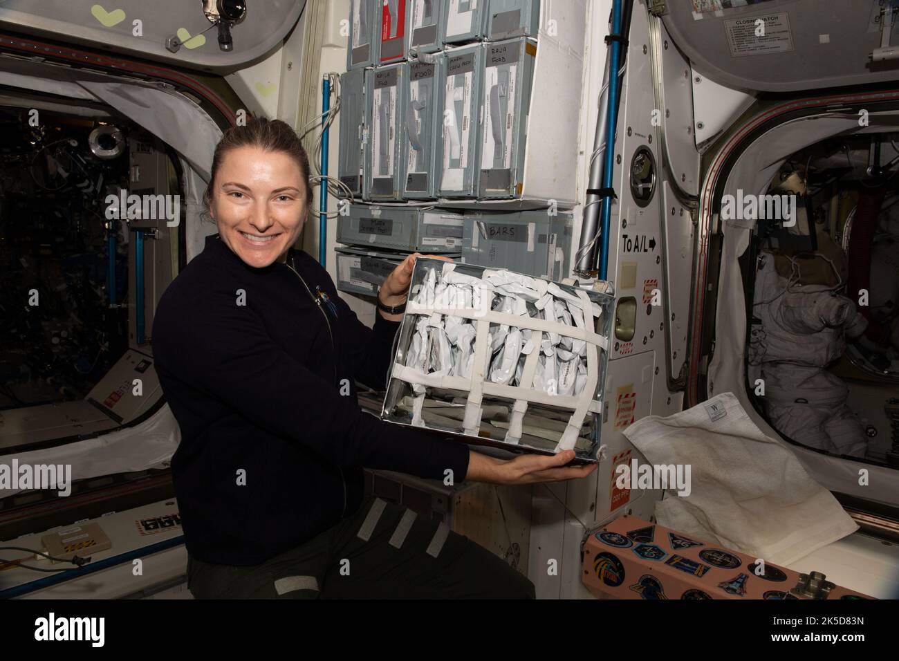 NASA astronaut and Expedition 66 Flight Engineer Kayla Barron shows off ...