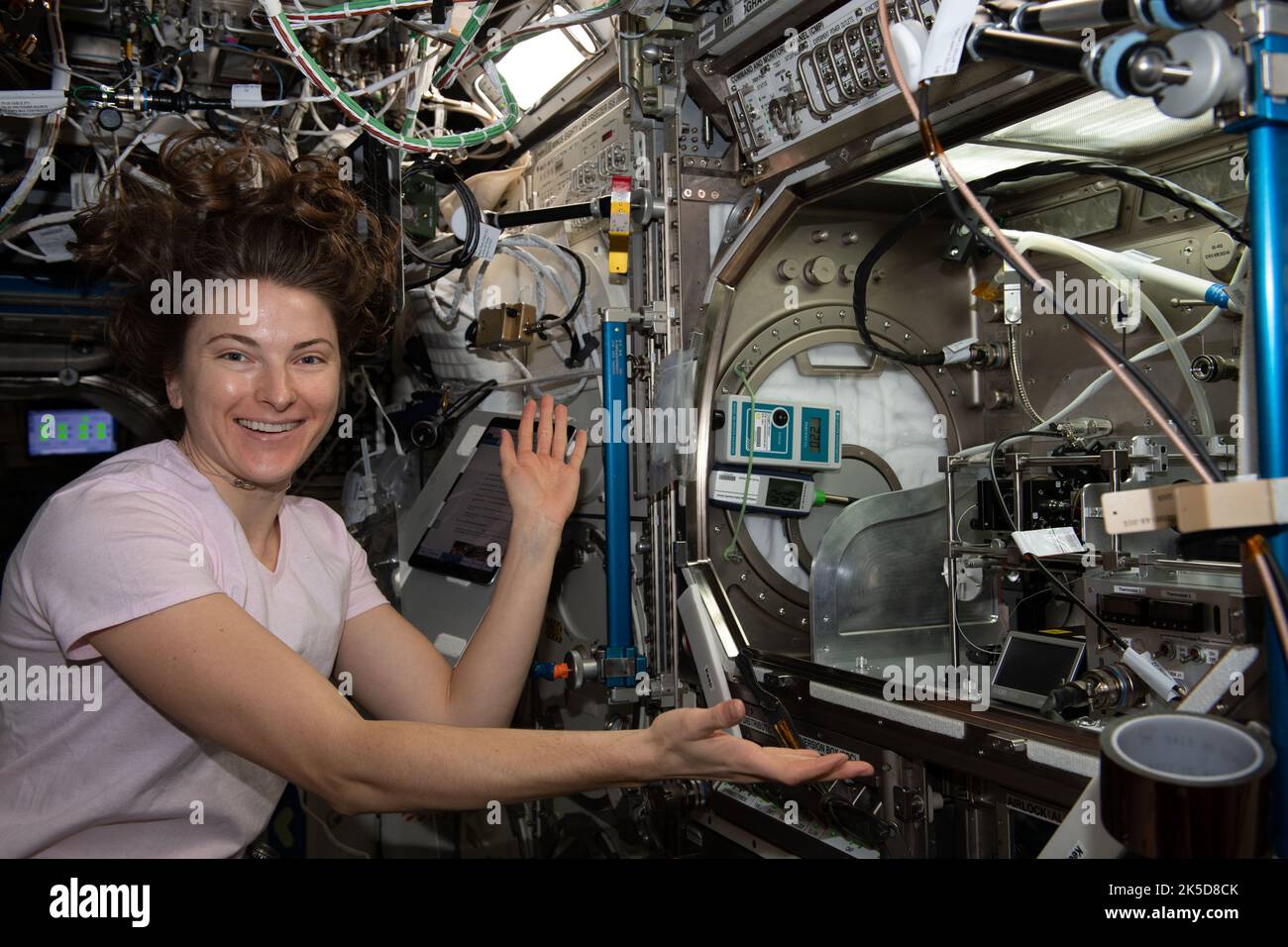 NASA astronaut and Expediiton 66 Flight Engineer Kayla Barron sets up hardware for the ...
