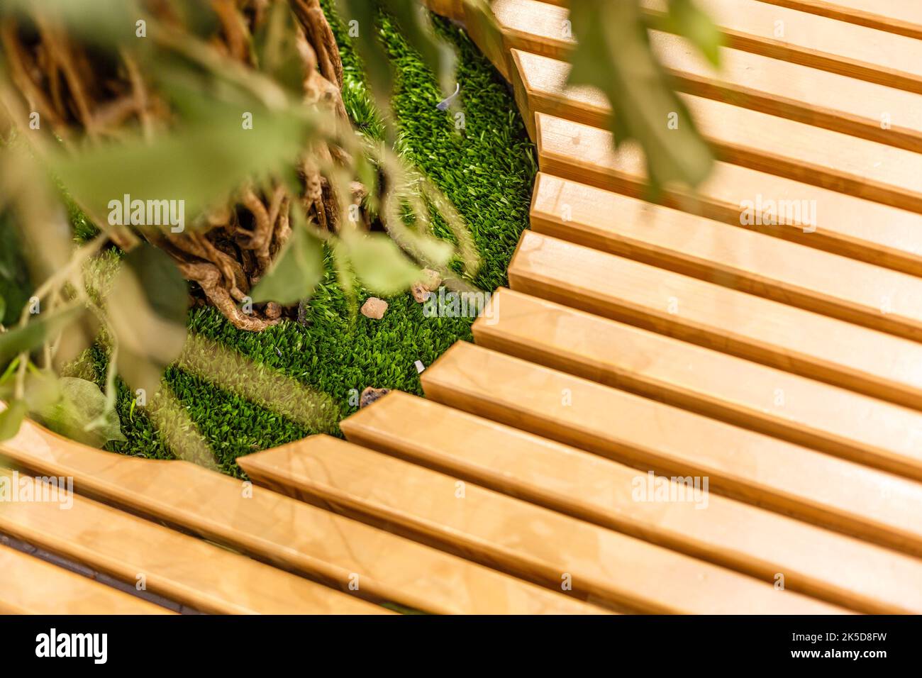 The long benches curved at corners stretch from the edge of the frame ...