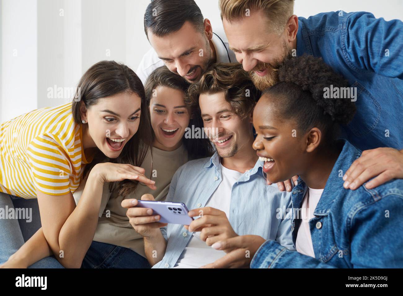 Man uses mobile phone to show vacation photos to his friends during ...