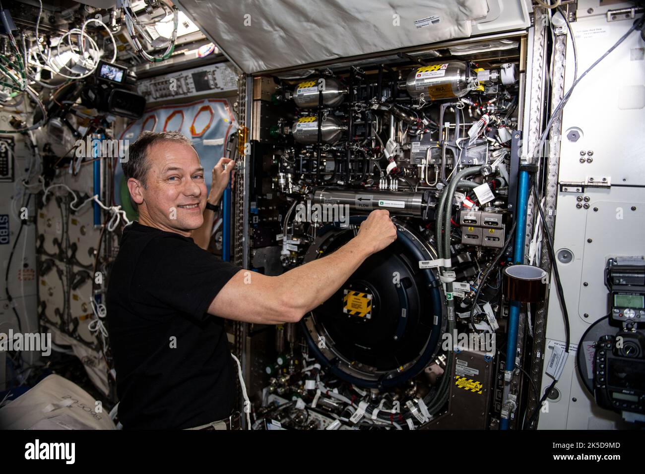 NASA astronaut Thomas Marshburn operates the Combustion Integrated Rack ...