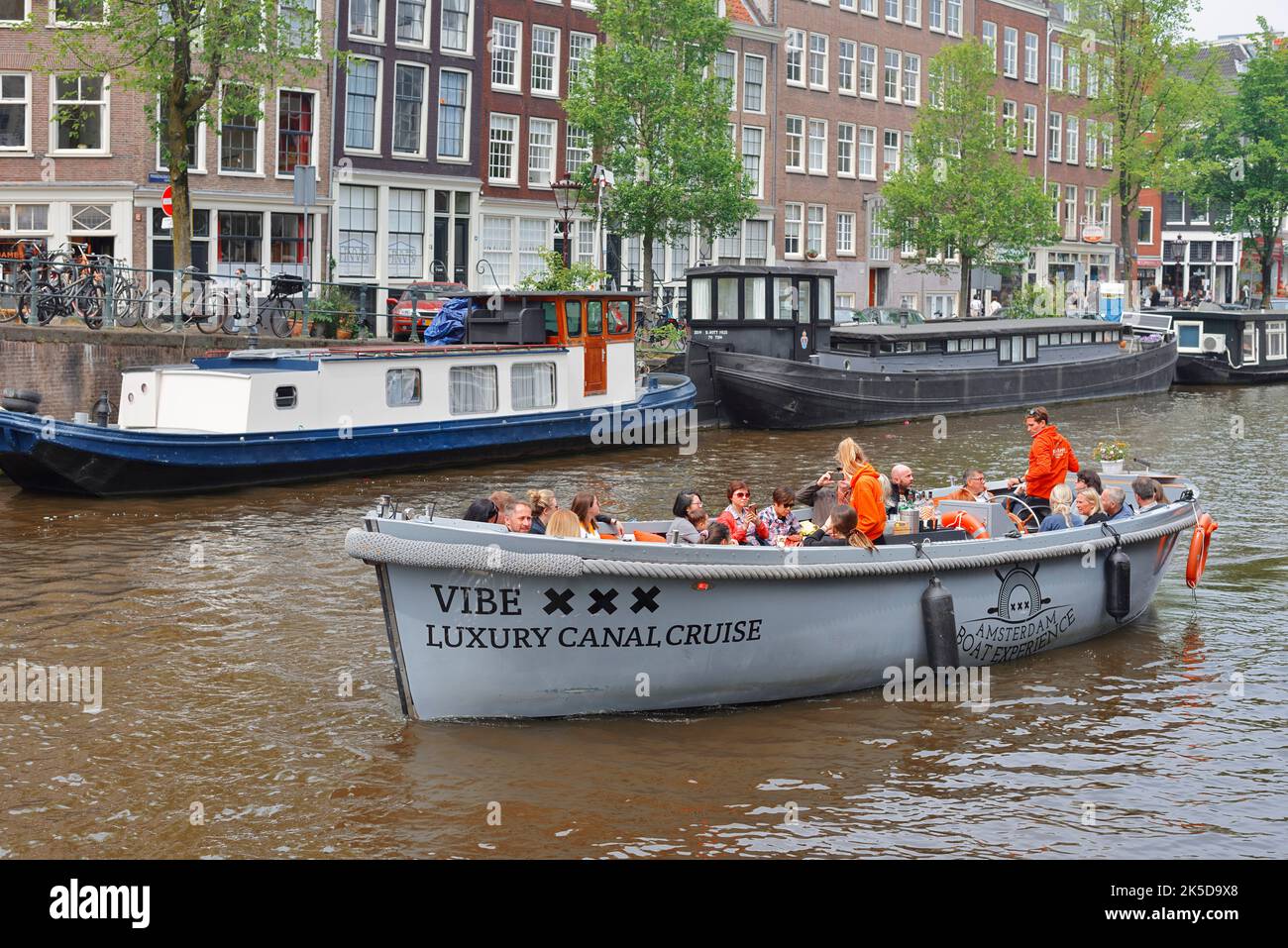 Excursion boat on canal, Amsterdam, North Holland, Netherlands Stock ...